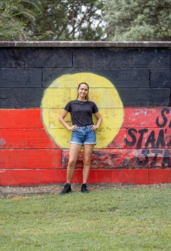 Image of Aboriginal woman standing proudly with her hands on her hips ...