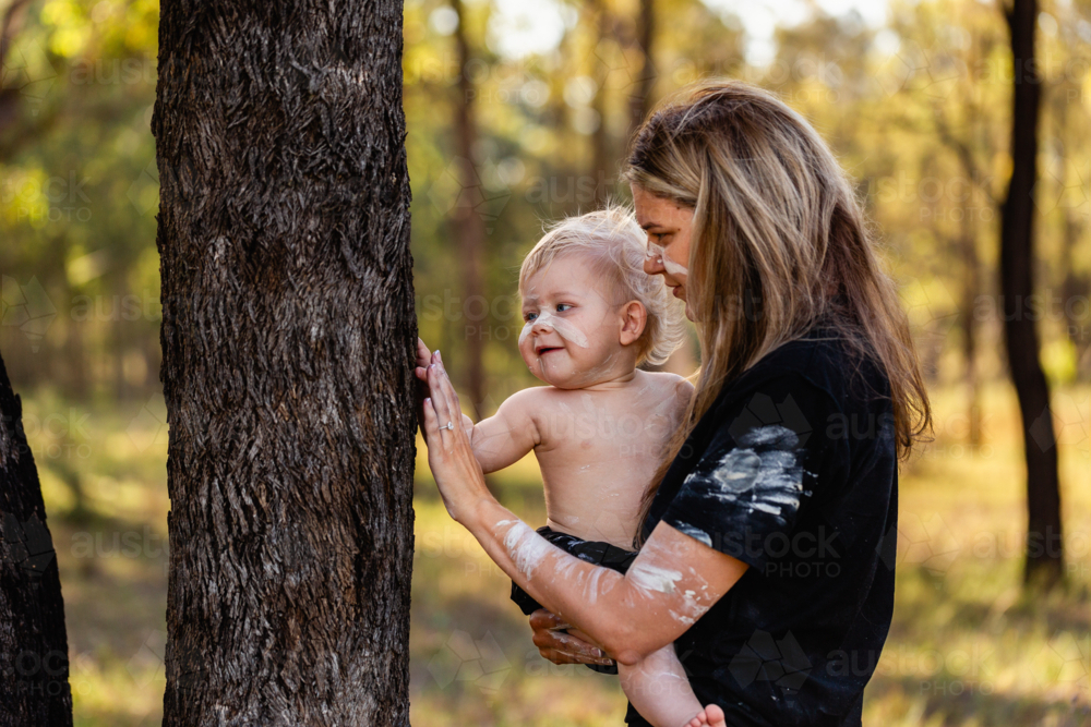 Image of Aboriginal woman with her baby boy in Australian bushland ...