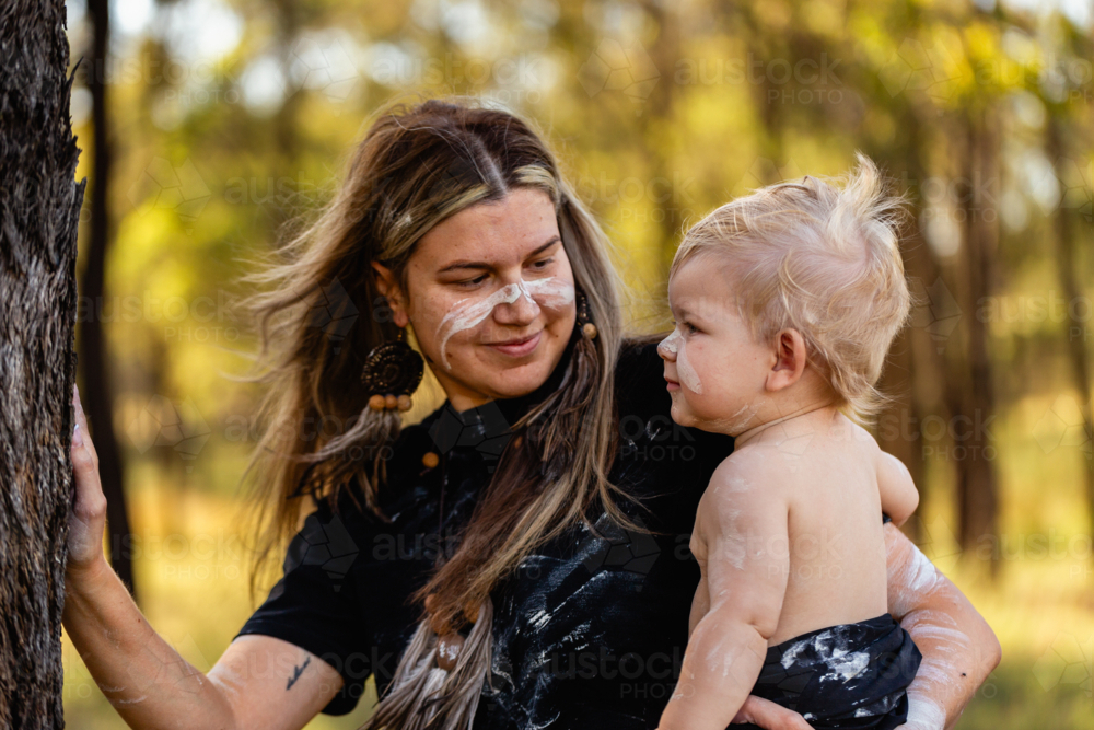 Image of Aboriginal woman with her baby boy in Australian bushland ...