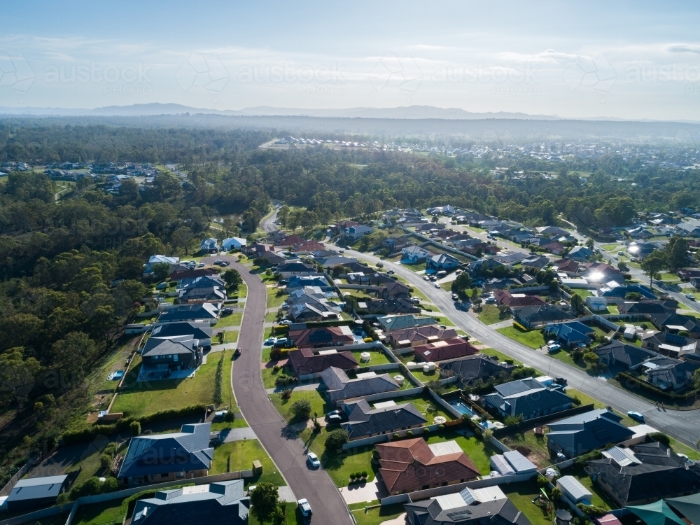 Image of Aerial image of sunlight shining off houses in residential ...