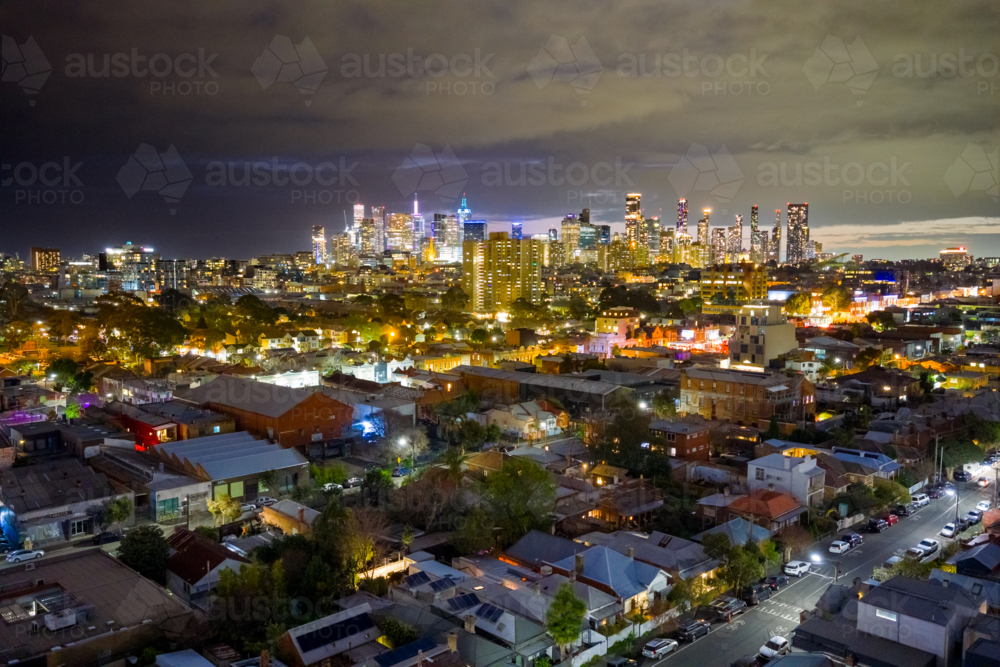 Image of Aerial night time view of colourful city lights over an urban ...