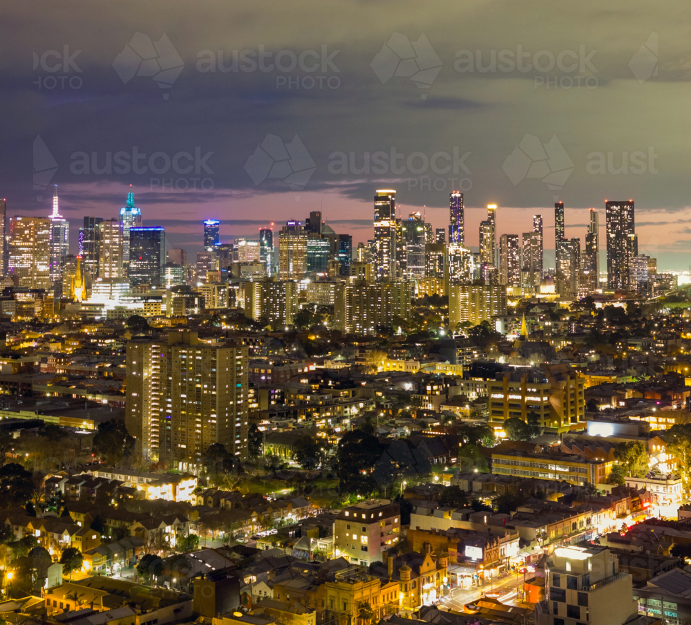 Image of Aerial night time view of colourful city lights over an urban ...