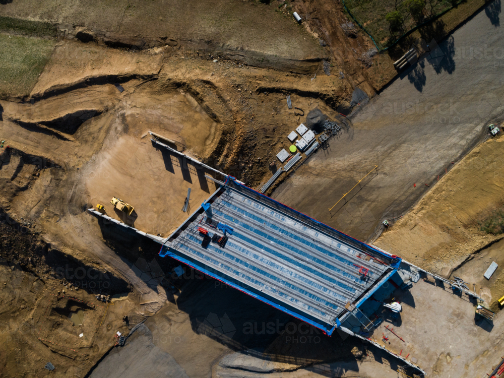 Image of Aerial overhead view of bridge and town bypass infrastructure ...