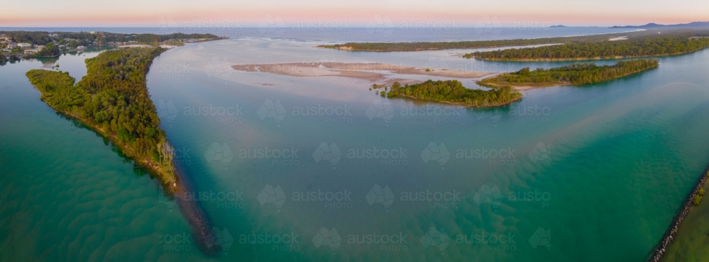 Image of Aerial panorama of a river system flowing around coastal ...