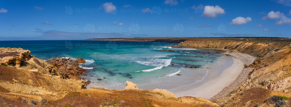 Image of Aerial panorama of a sheltered coastal bay surrounded by ...