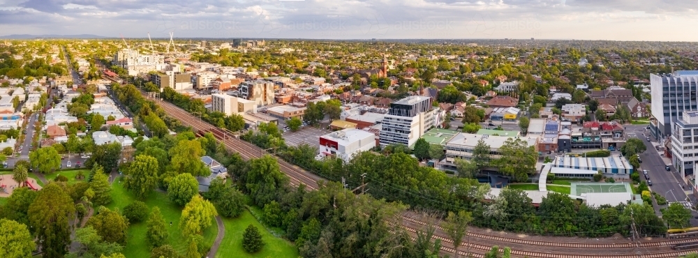 Image of Aerial panorama of an inner city railway line between a park ...