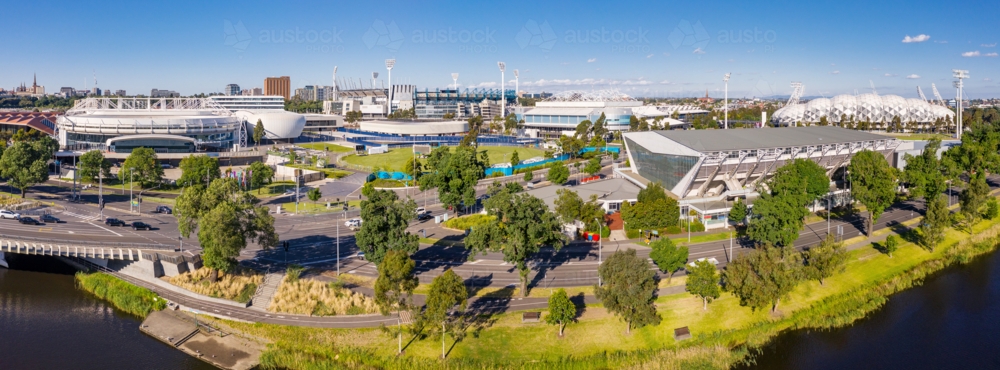 Image of Aerial panorama of arenas in a sports precinct beside an inner ...