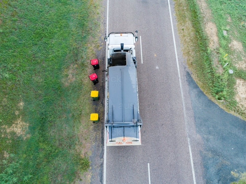 Image of Aerial photo of garbage truck emptying bins in rural location ...