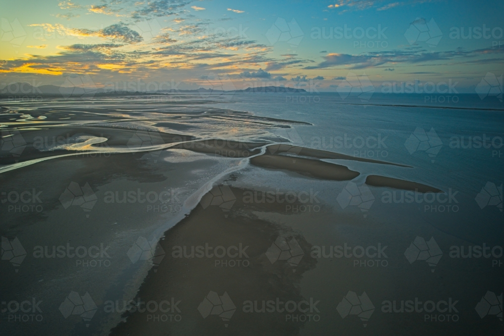 Image of Aerial sunrise over North Queensland beaches and islands, with ...