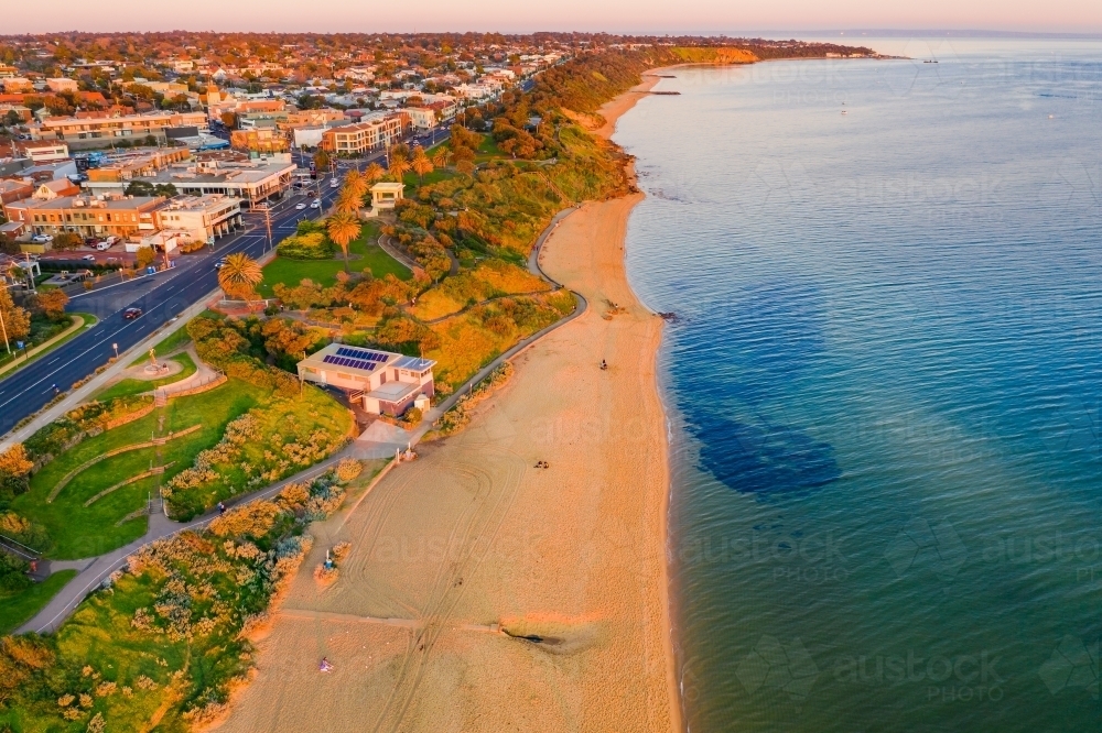 Image of Aerial view a bay side beach reserve with a surf life saving ...