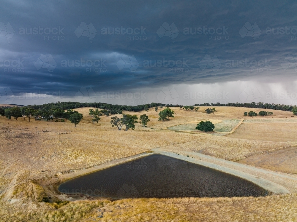 Image of Aerial view a triangular dam on rural farmland with rain ...