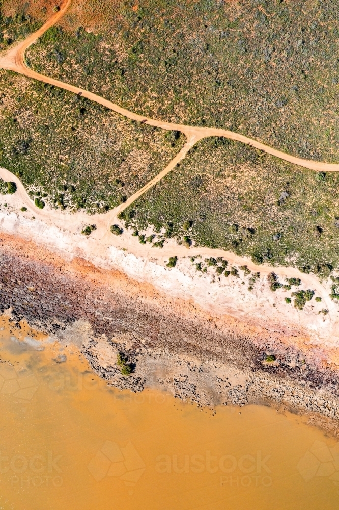 Image of aerial view looking down on coastal tracks along the Pilbara ...