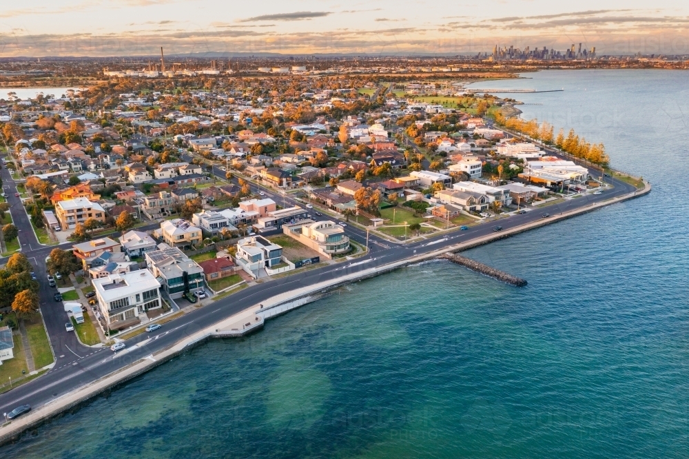 Image of Aerial view of a bay side suburb and esplanade at dusk ...
