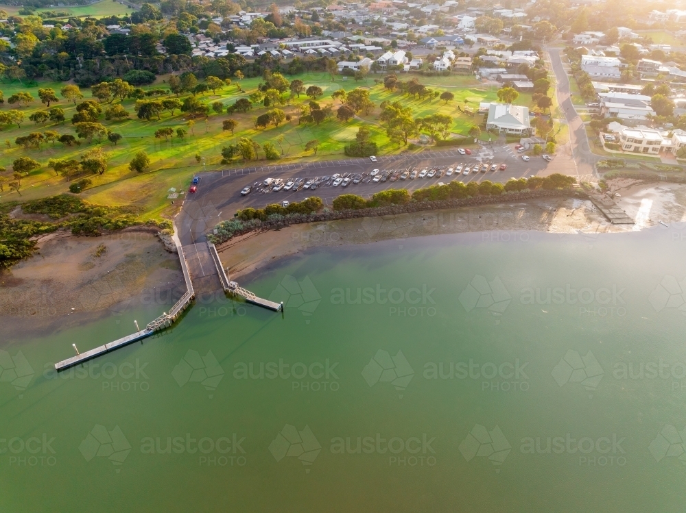 Image of Aerial view of a boat ramp and carpark near a golf course on ...