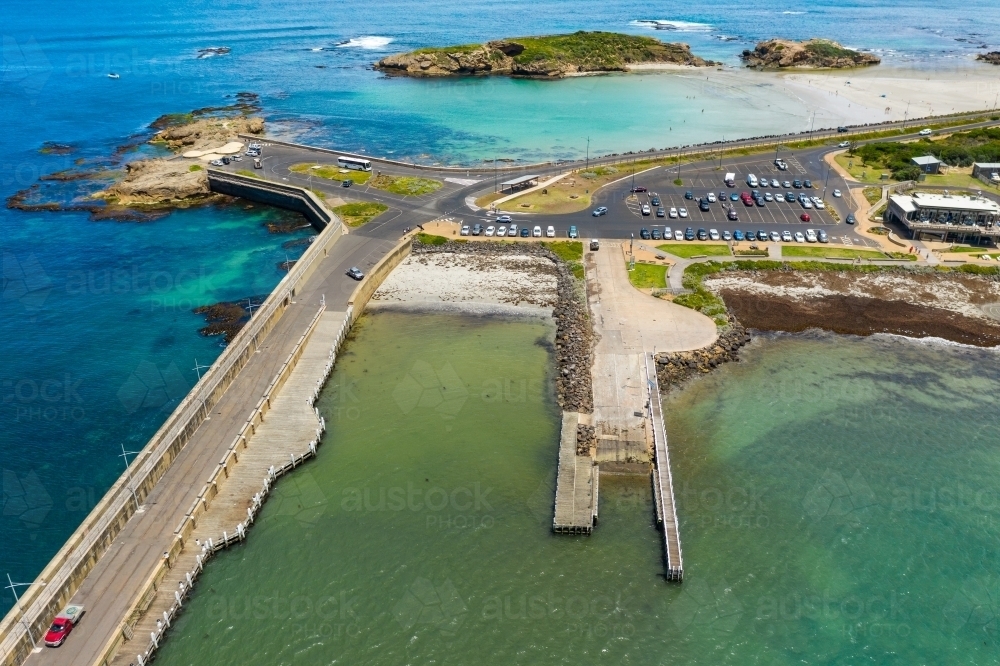 Image of Aerial view of a boat ramp and long breakwater jutting out ...