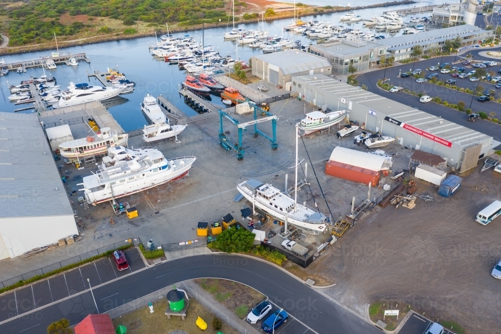 Image of Aerial view of a boat yard at a coastal marina - Austockphoto