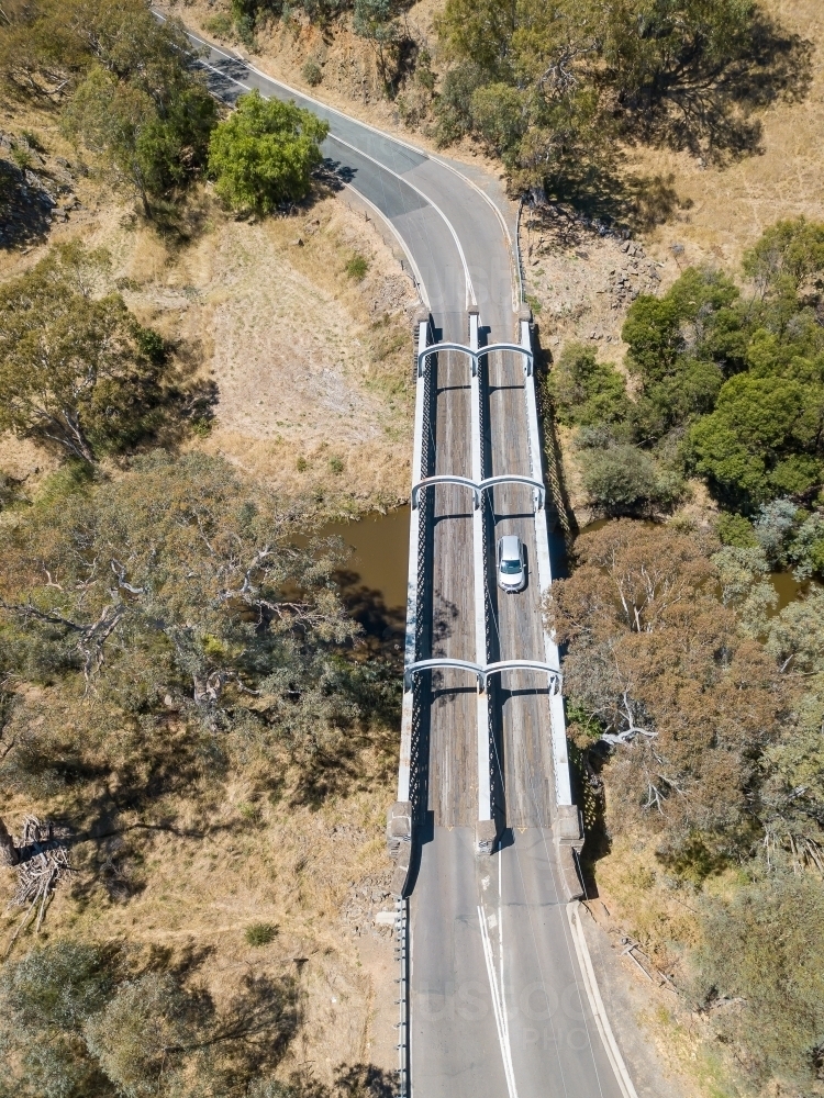 Image of Aerial view of a bridge on a country road crossing over a ...