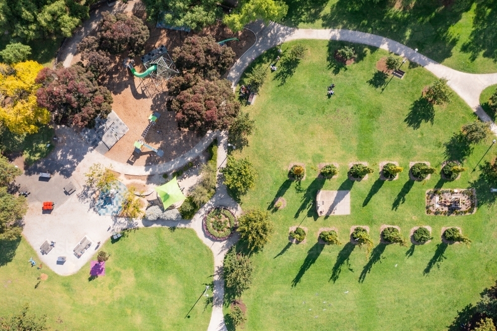 Image of Aerial view of a city park with walking tracks and a ...