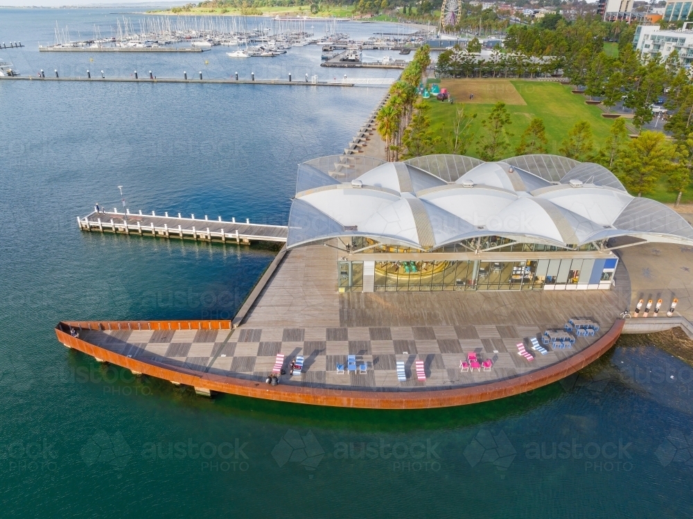 Image of Aerial view of a city waterfront with a domed pavilion and modern boardwalk and decking ...