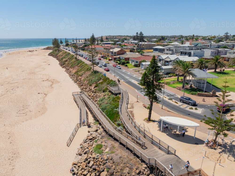 Image of Aerial view of a coastal esplanade and a zig zagging ramp down ...