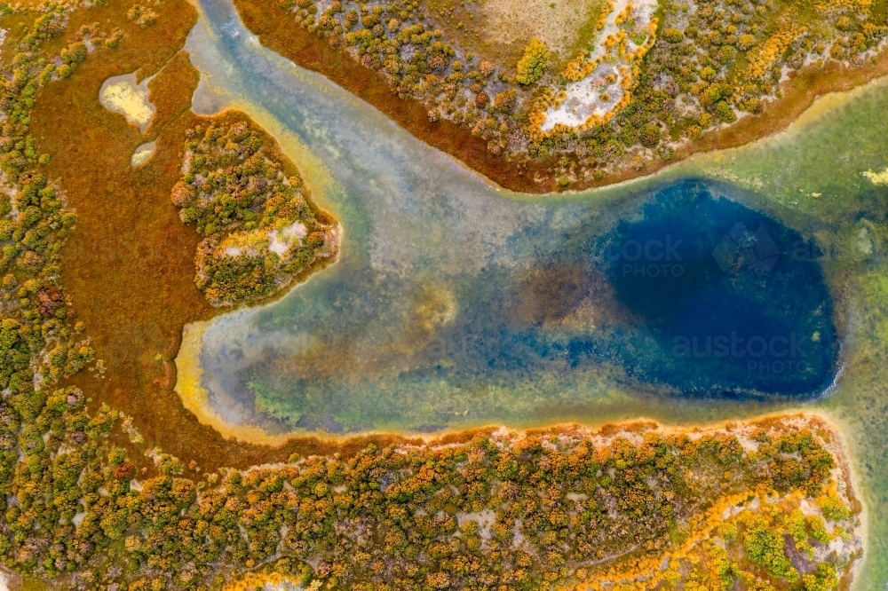 Image of Aerial view of a coastal lagoon surrounded by scrub - Austockphoto