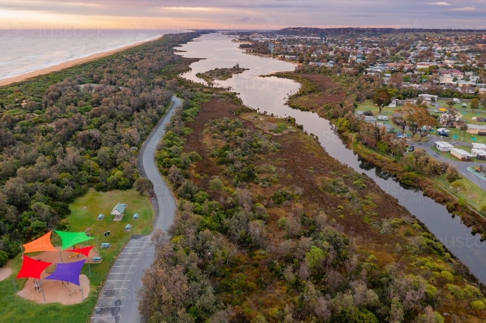 Image of Aerial view of a coastal playground alongside a winding river ...