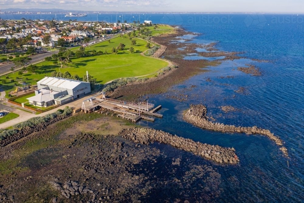 Image of Aerial view of a coastal reserve and rocky reefs surrounding a ...