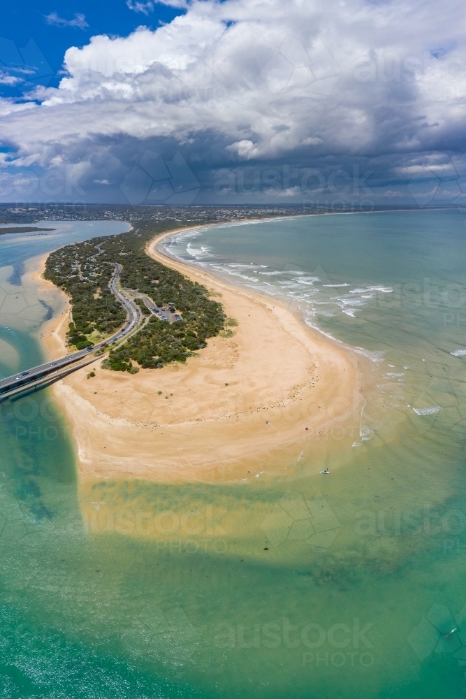 Image of Aerial view of a coastal sand beach around a narrow strip of ...