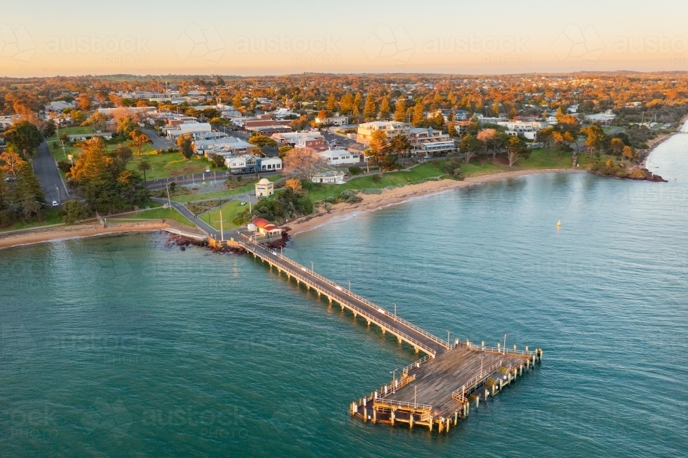 Image of Aerial view of a coastal town and a long straight jetty ...