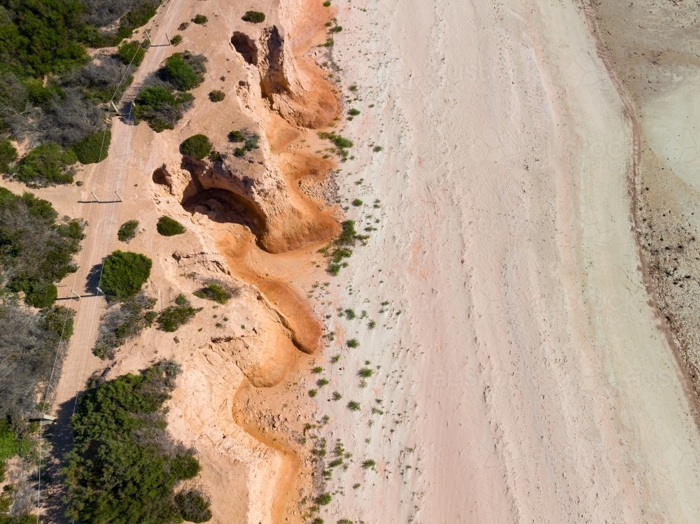 Image of Aerial view of a coastal walking track above eroded cliffs and ...