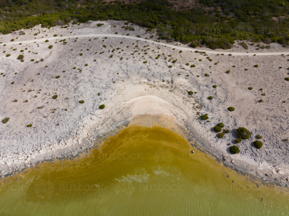 Image of Aerial view of a crusty shoreline and walking track around a ...