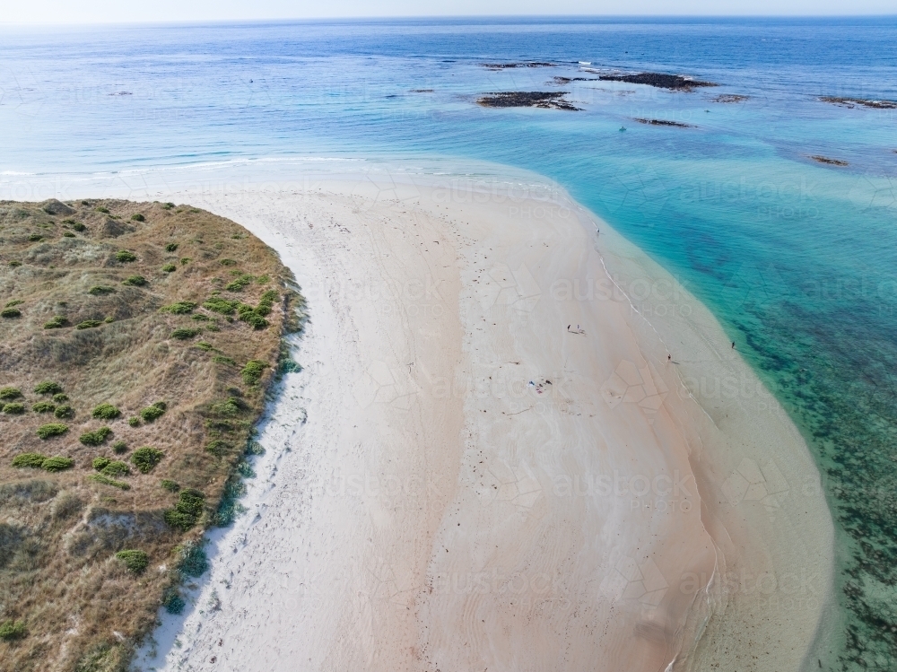 Image of Aerial view of a curved white sandy beach between turquoise ...