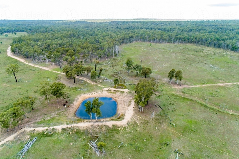 Image of Aerial view of a farm dam and paddock. - Austockphoto