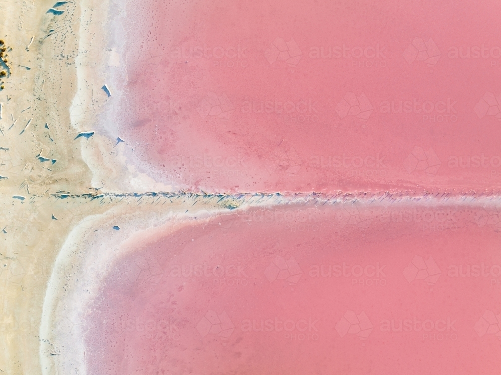 Image of Aerial view of a fence line running from the shoreline into a ...