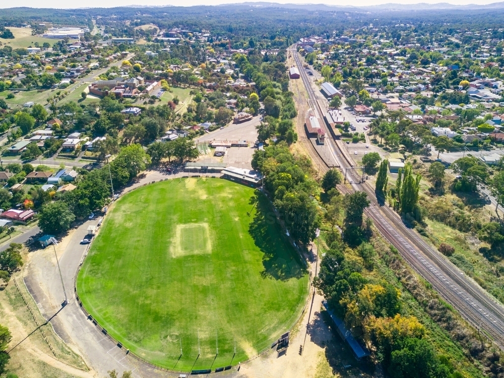 Image of Aerial view of a football oval next to a railway line ...
