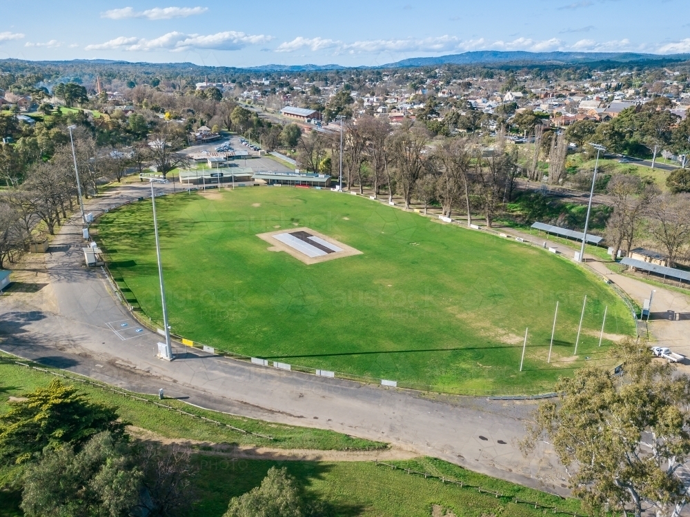 Image of Aerial view of a football oval next to a railway line ...