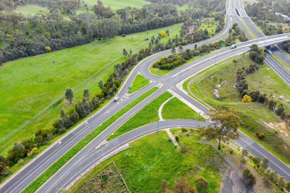 Image of Aerial view of a freeway on and off ramp intersection ...
