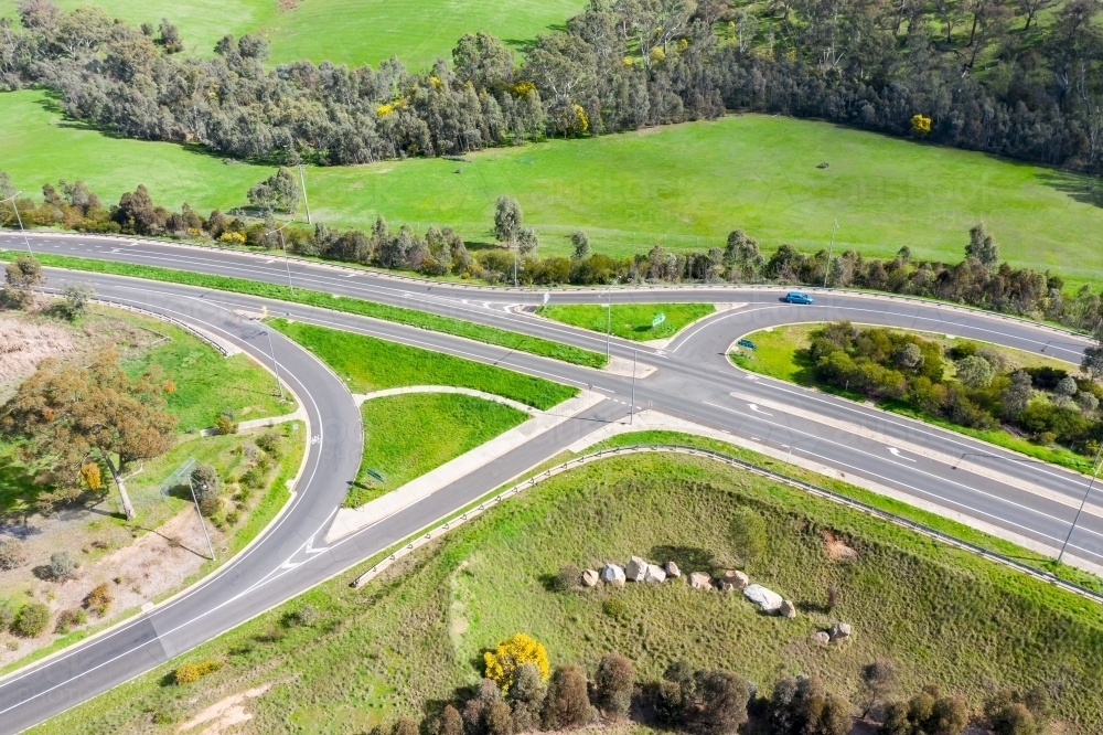 Image of Aerial view of a freeway on and off ramp intersection ...