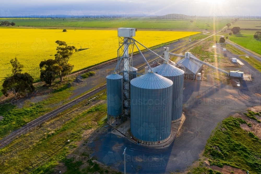 Image of Aerial view of a grain silo along side a railway line and a ...