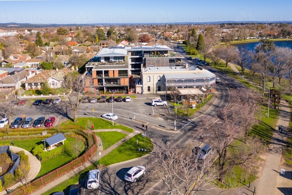 Image of Aerial view of a hotel complex on a busy lakeside road ...