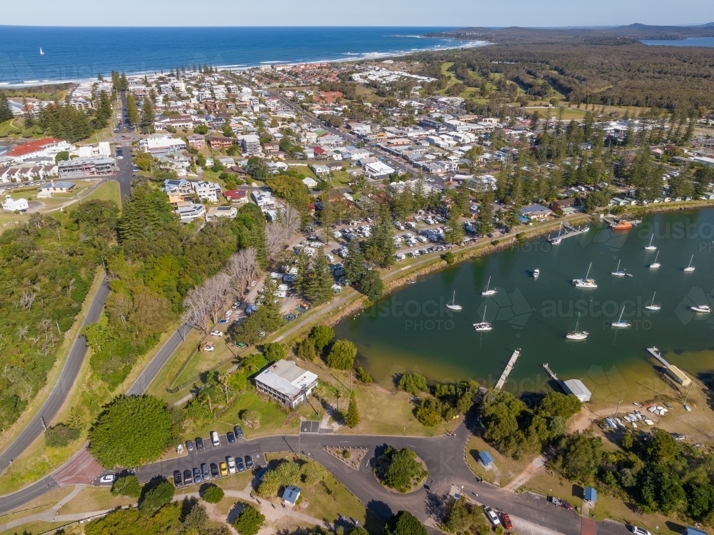 Image of Aerial view of a large coastal town between a small sheltered ...