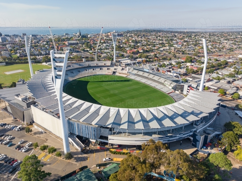 Image of Aerial view of a large inner city sports arena with tall light ...