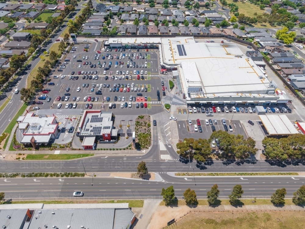 Image of Aerial view of a large shopping centre and carpark on a busy ...