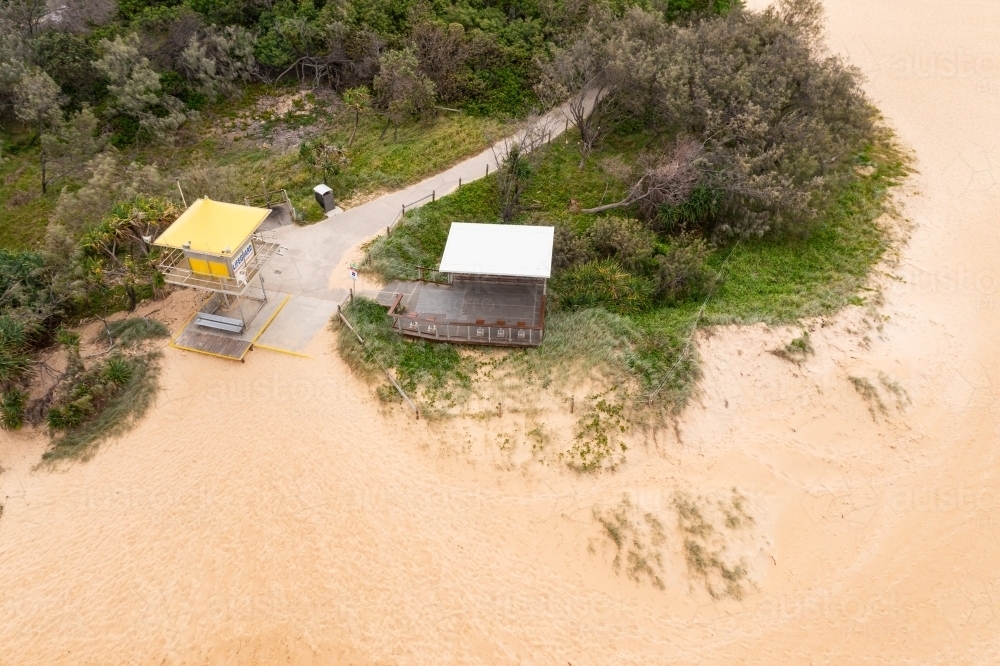 Image of Aerial view of a lifesaving tower and amenities block above a ...