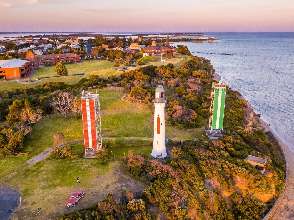 Image of Aerial view of a lighthouse and towers on a clifftop ...