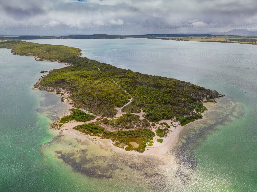 Image of Aerial view of a long narrow island covered in vegetation in a ...