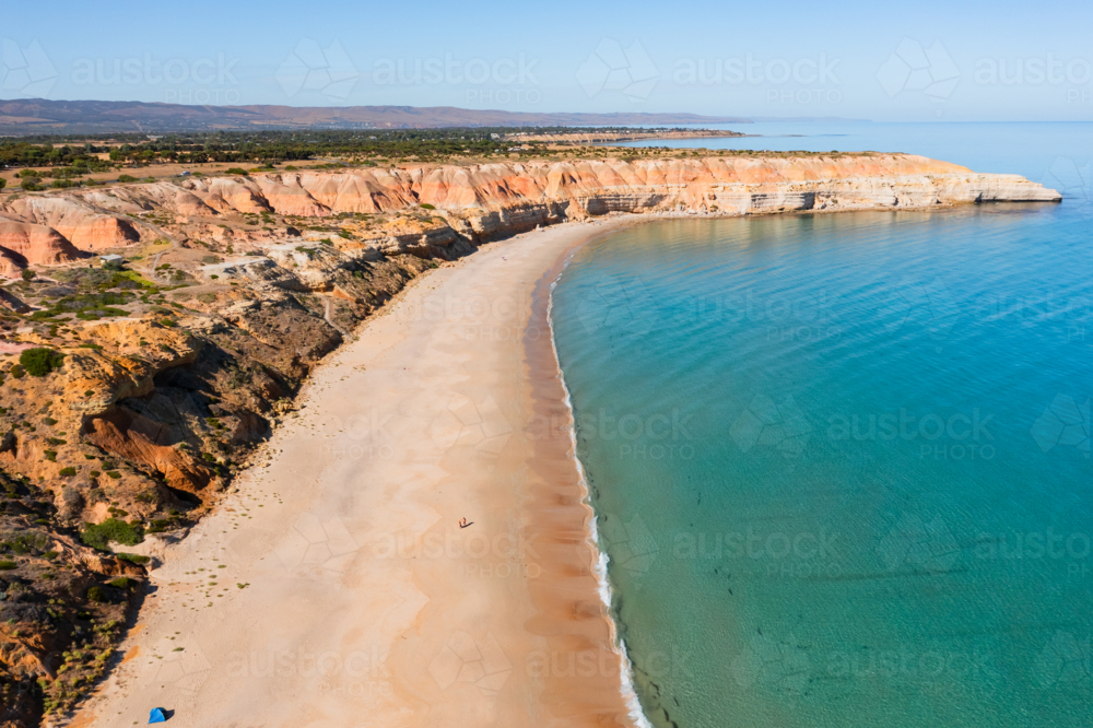 Image of Aerial view of a long sandy beach and a calm turquoise ocean ...