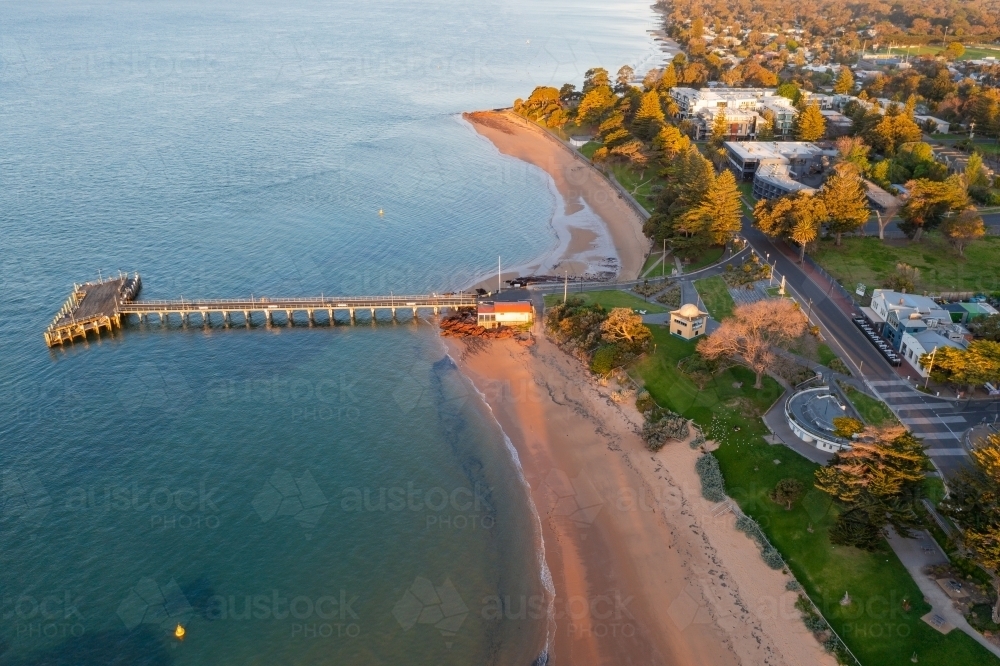 Image of Aerial view of a long straight jetty leading and coastal ...