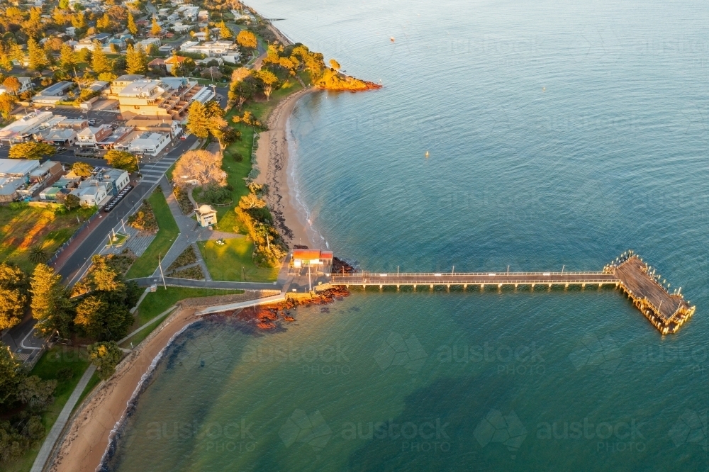 Image of Aerial view of a long straight jetty leading out to a platform ...