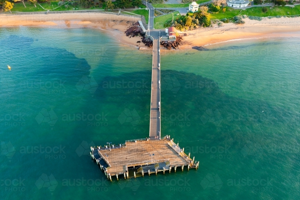 Image of Aerial view of a long straight jetty leading out to a platform ...